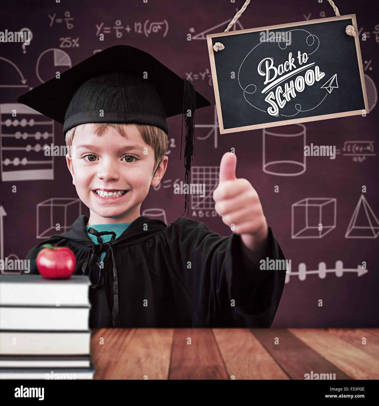 Boy in red graduation gown hi-res stock photography and images - Alamy