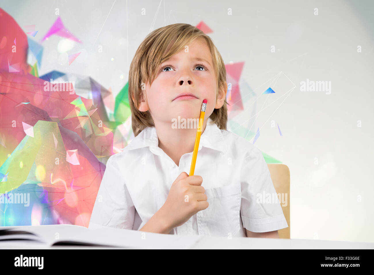 Composite image of cute pupil thinking Stock Photo - Alamy