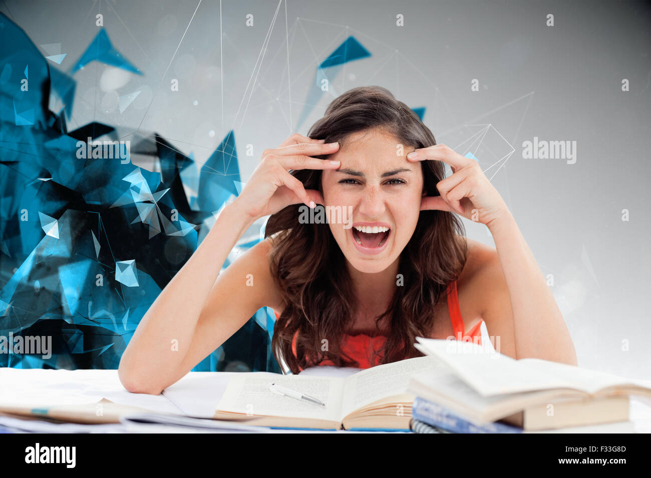 Composite image of student goes crazy doing her homework Stock Photo ...