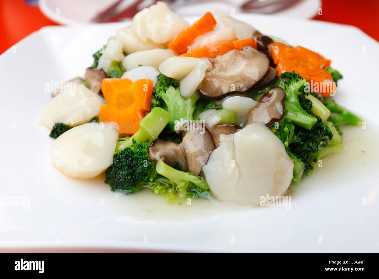 Seafood dish of scallops & mixed vegetables including mushrooms and ...