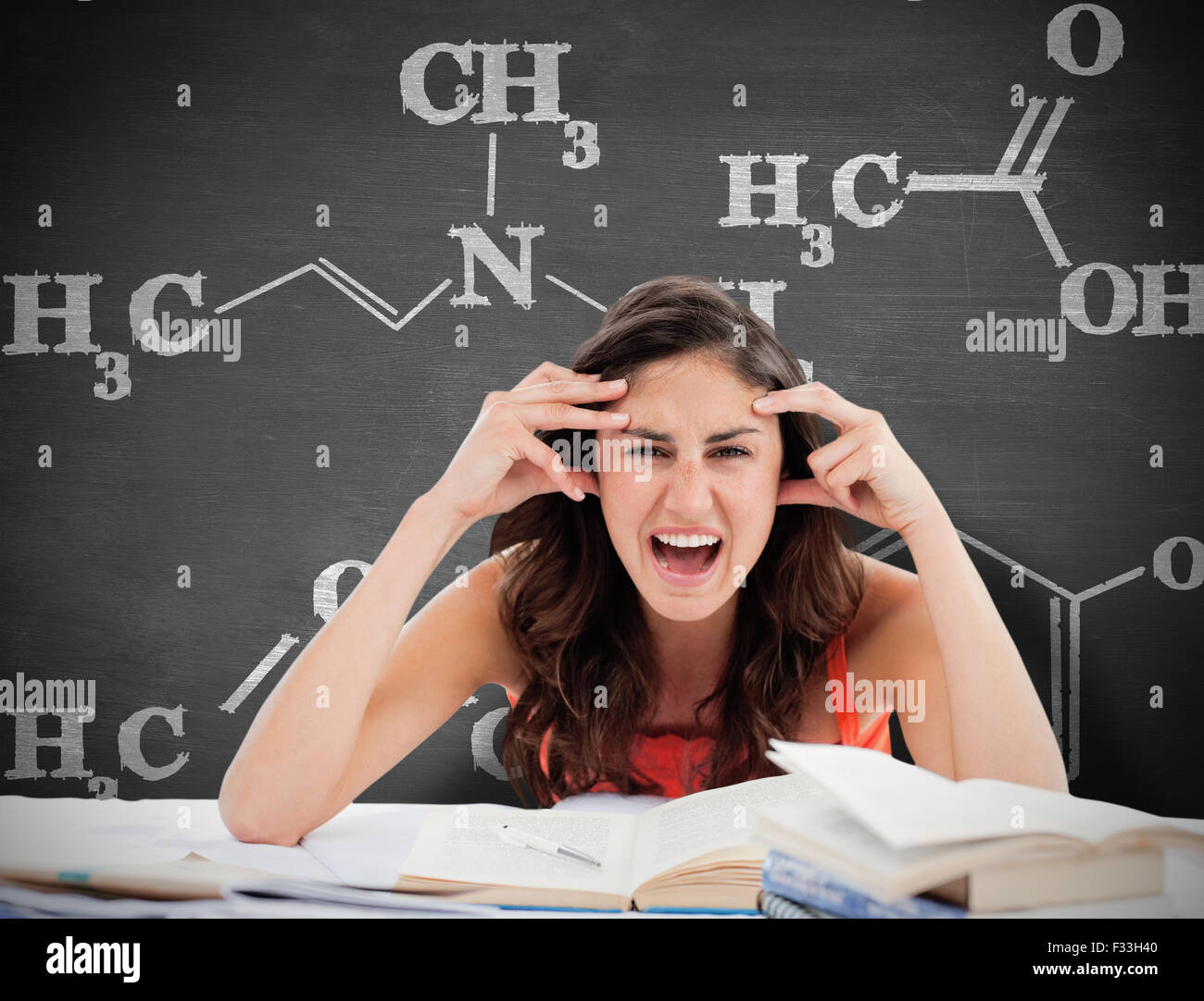 Composite image of student goes crazy doing her homework Stock Photo ...