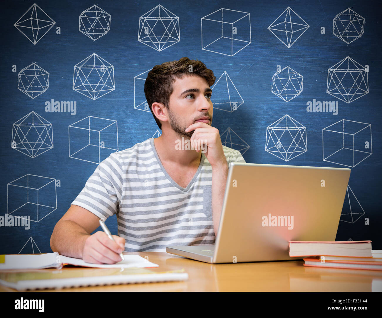 Composite image of student studying in the library with laptop Stock ...
