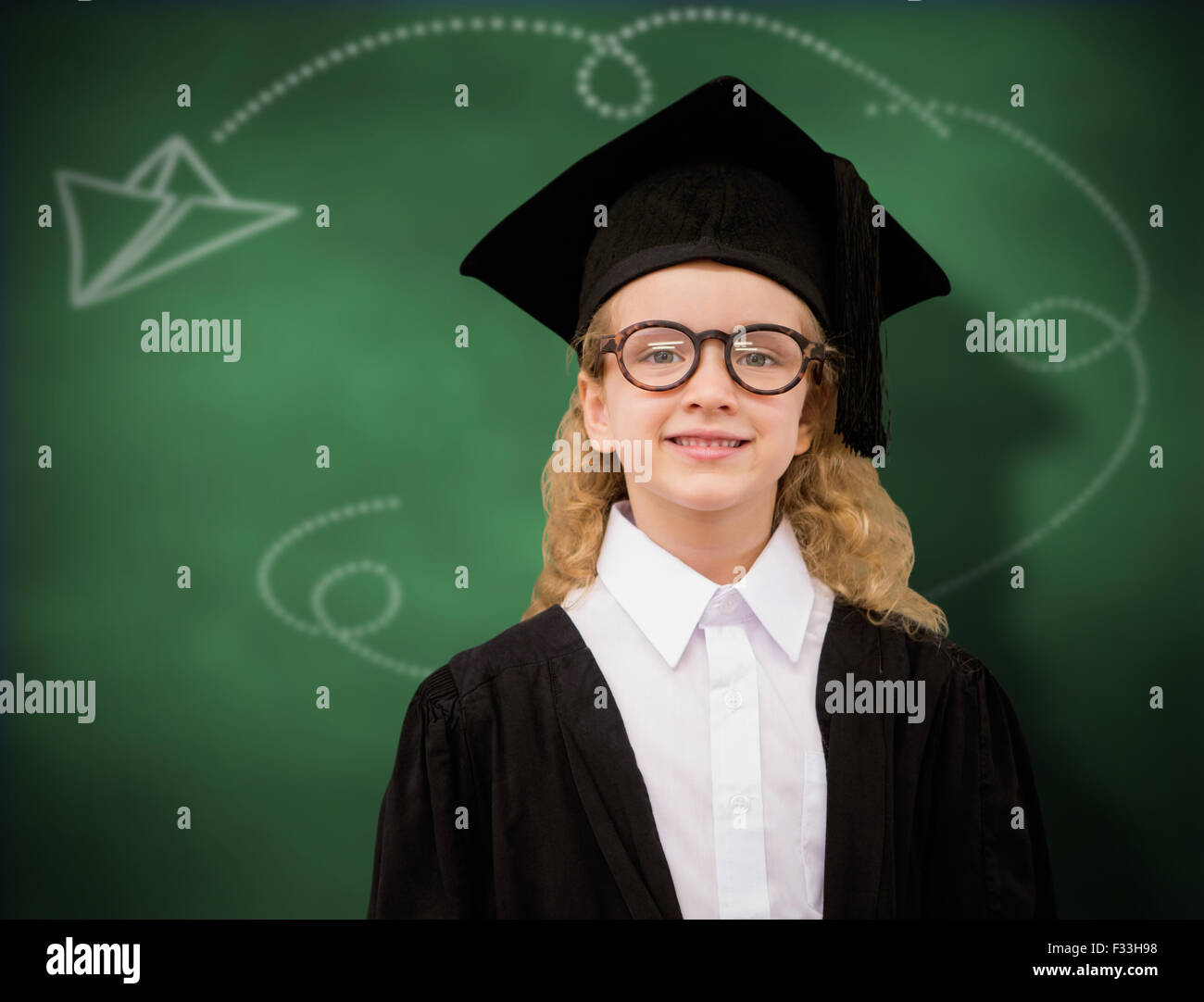 Composite image of cute pupil in graduation robe Stock Photo - Alamy