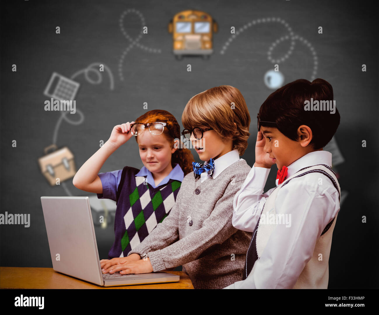 Composite image of pupils using laptop Stock Photo - Alamy