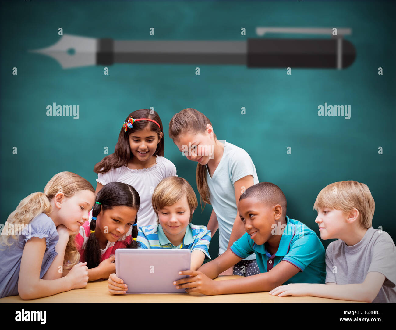 Composite image of cute pupils using tablet computer in library Stock ...