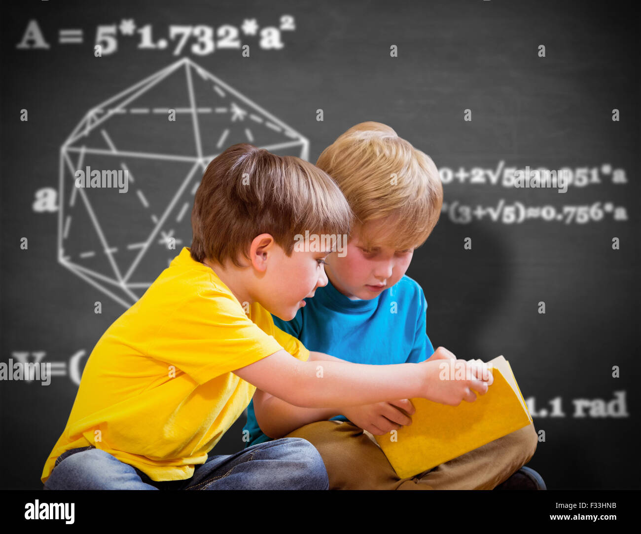 Composite image of pupils reading book Stock Photo - Alamy
