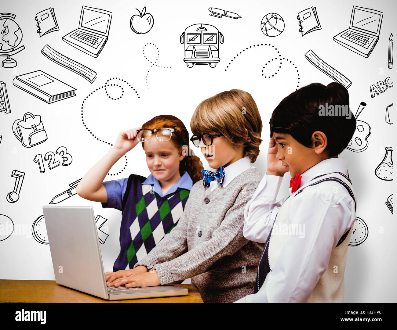 Composite image of pupils using laptop Stock Photo - Alamy