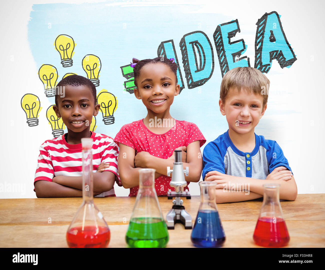 Composite image of cute pupils standing with arms crossed behind beaker ...
