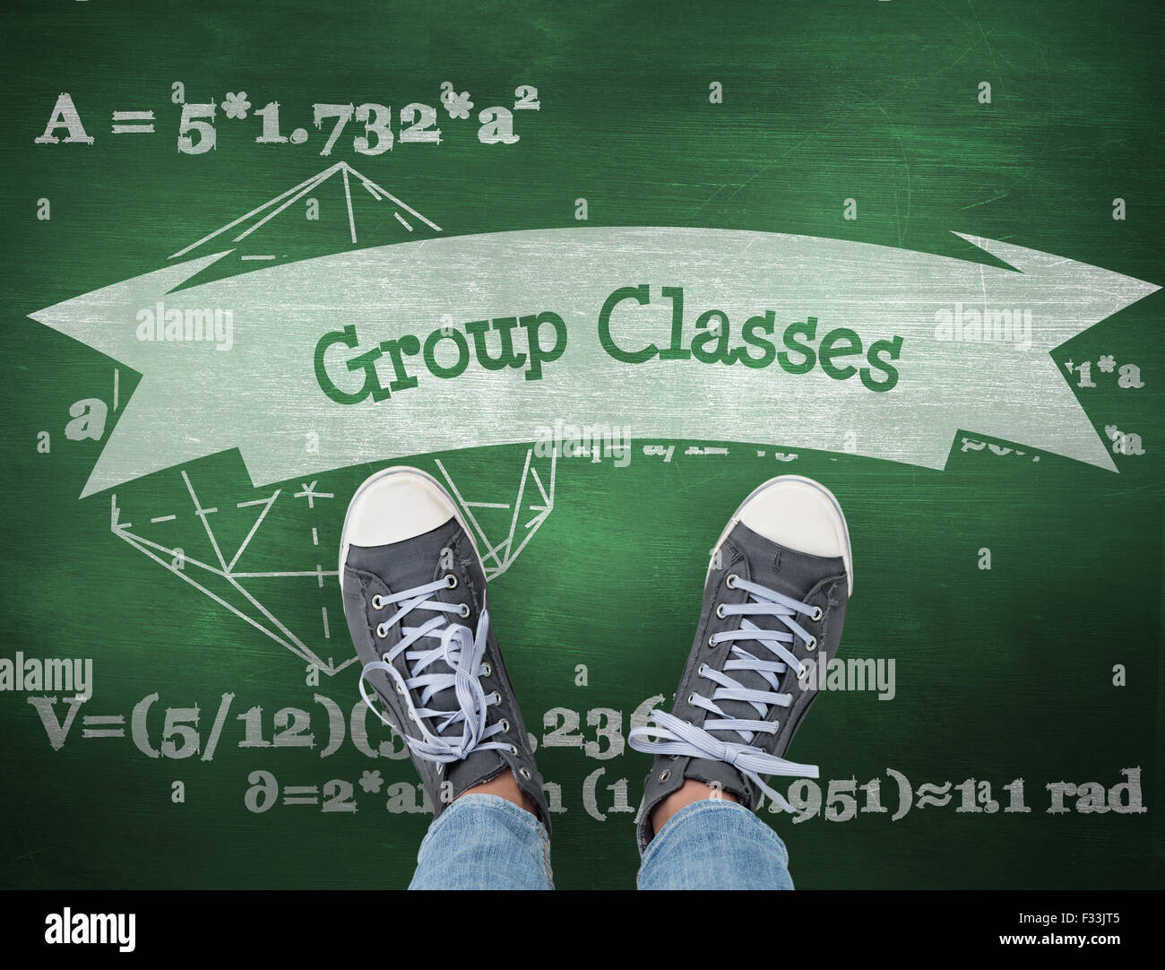 Group classes against green chalkboard Stock Photo - Alamy