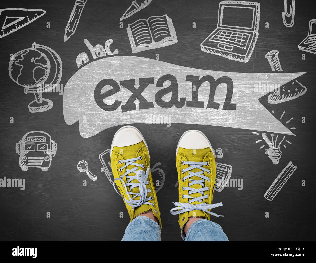 Exam against black background Stock Photo - Alamy