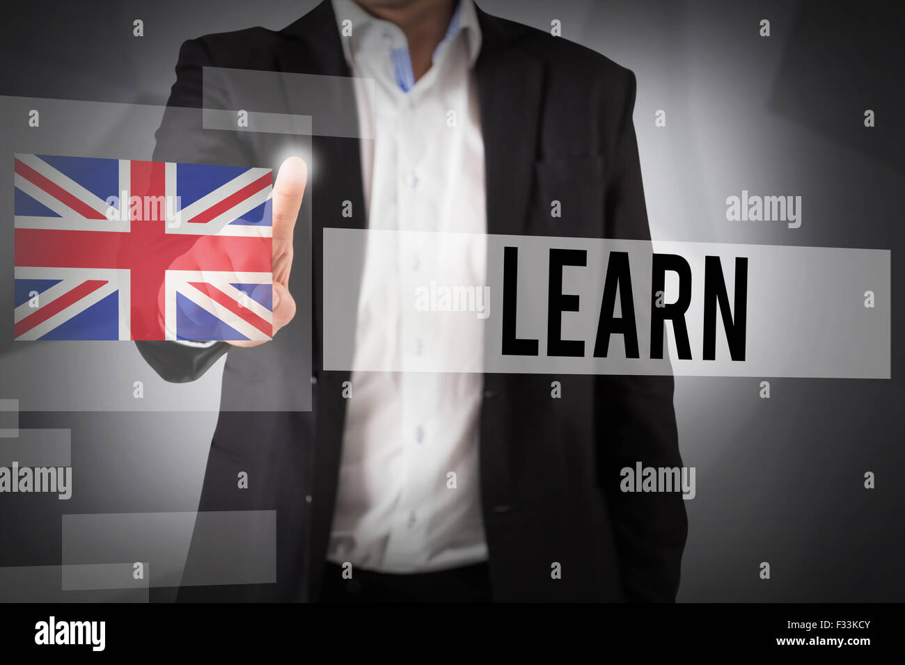 Learn against abstract grey room Stock Photo - Alamy