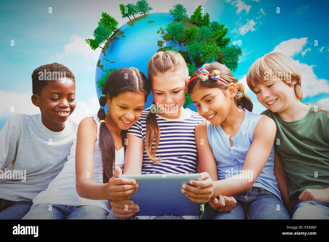 Composite image of children using digital tablet at park Stock Photo ...