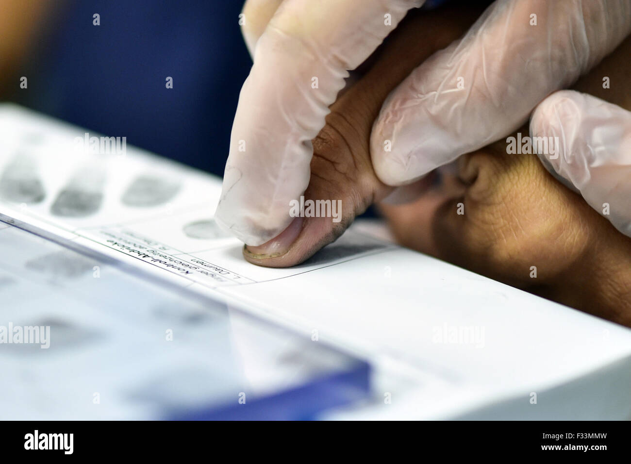 Heidelberg, Germany. 29th Sep, 2015. An employee takes fingerprints of ...