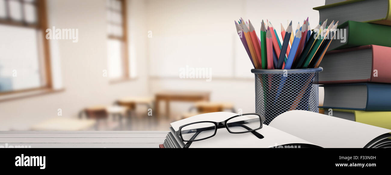 Composite image of school supplies on desk Stock Photo - Alamy