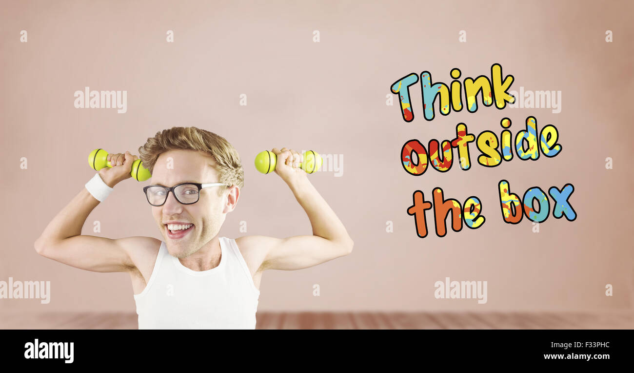 Composite image of nerd lifting weights Stock Photo - Alamy