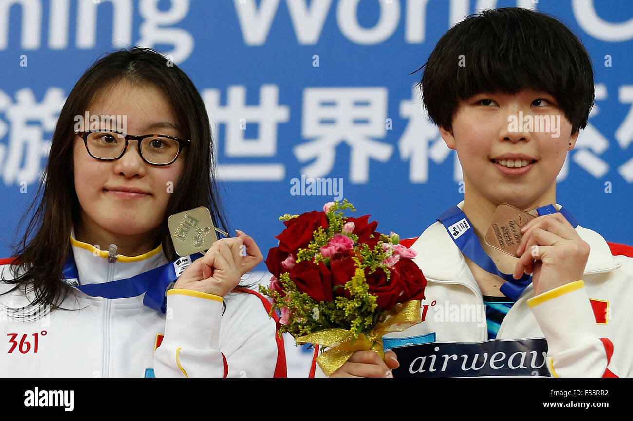 Beijing, China. 29th September, 2015. China's Fu Yuanhui (L) poses with ...