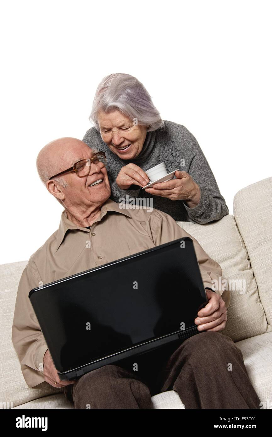 Senior couple on laptop Stock Photo - Alamy