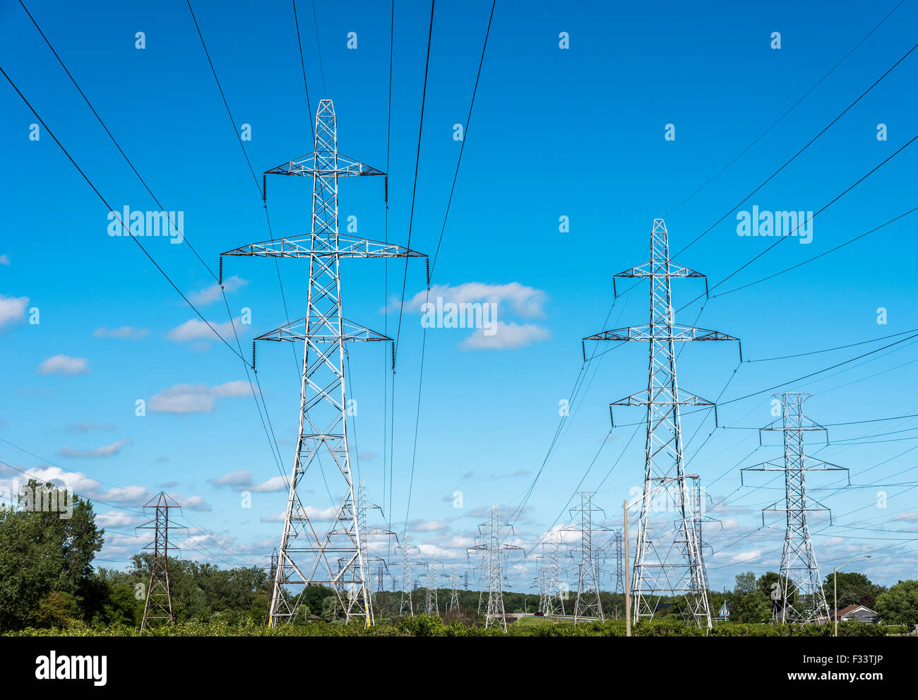 Hydro towers and power lines in a field Stock Photo - Alamy