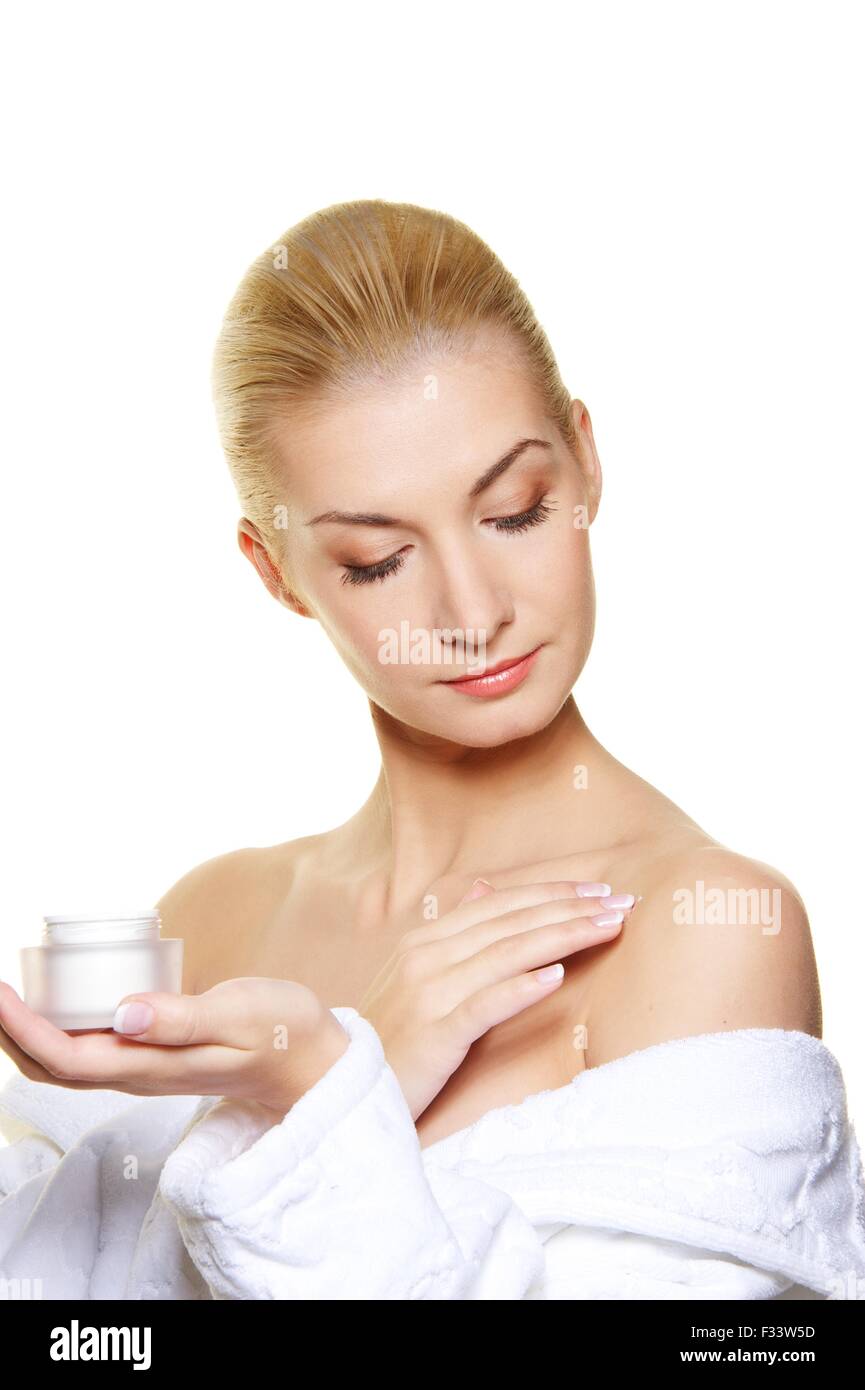 Woman applying moisturizer cream on her body Stock Photo - Alamy
