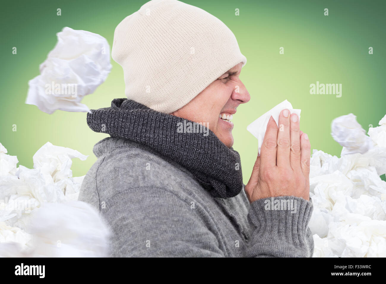 Composite image of casual man about to sneeze Stock Photo - Alamy