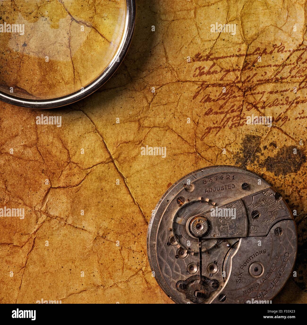 Lope with a gears on the old textured paper Stock Photo - Alamy