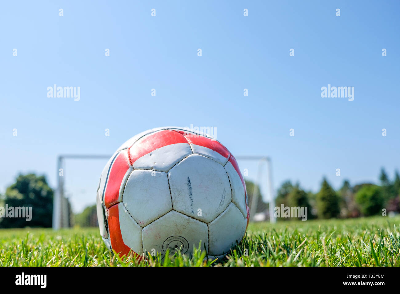A football placed on the penalty spot sits in front of the goal Stock ...
