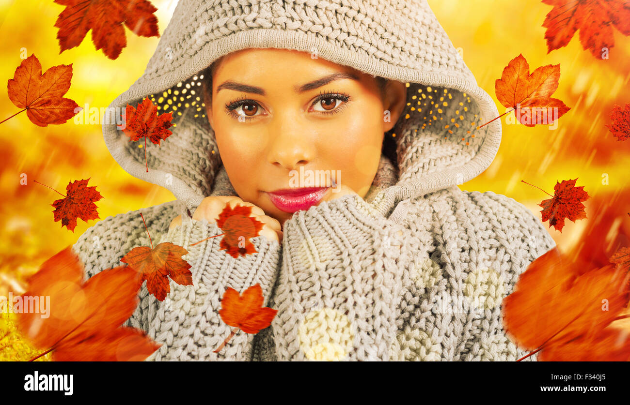 Composite image of pretty girl in winter jumper looking at camera Stock ...