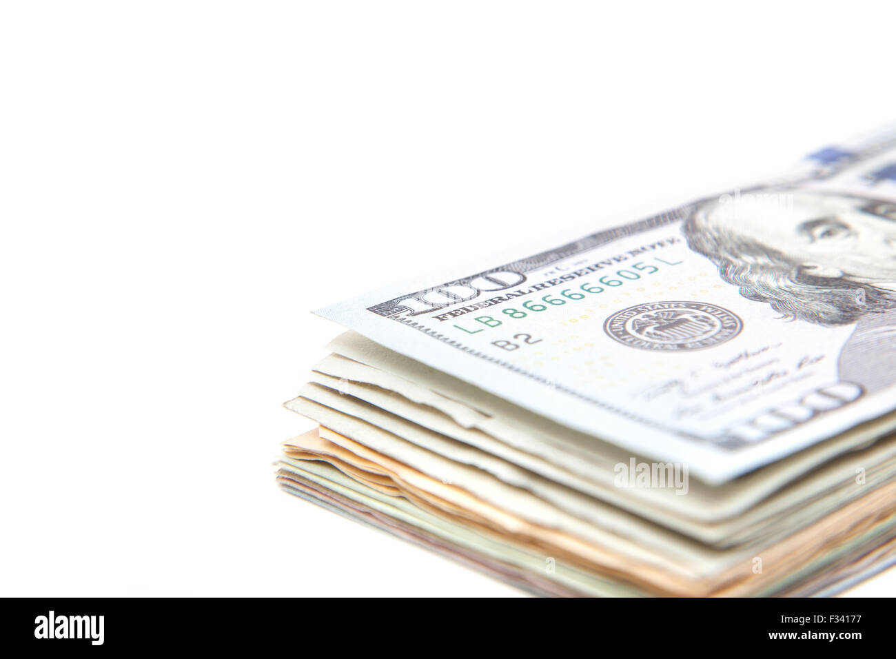 Pile of dollar notes. All on white background Stock Photo - Alamy