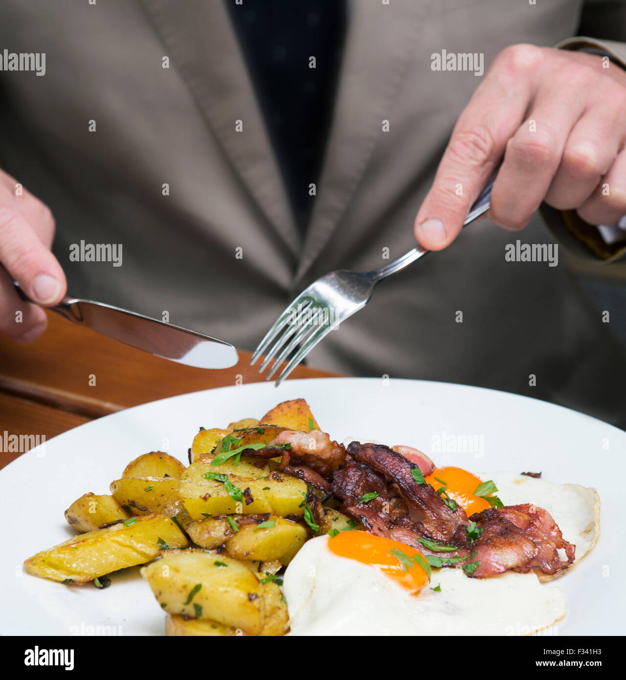 Fat man eating dinner suit hi-res stock photography and images - Alamy