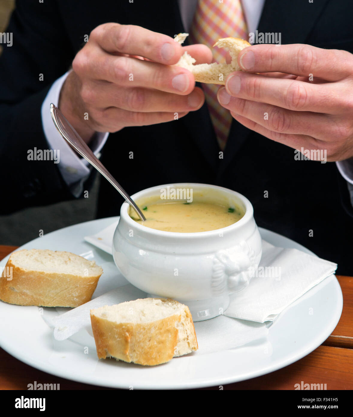 Man eating dinner suit hi-res stock photography and images - Alamy