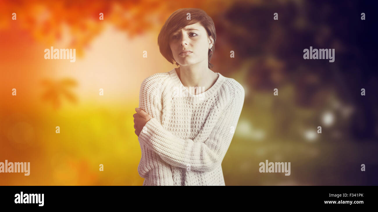 Composite image of sad pretty brunette leaning against wall Stock Photo ...