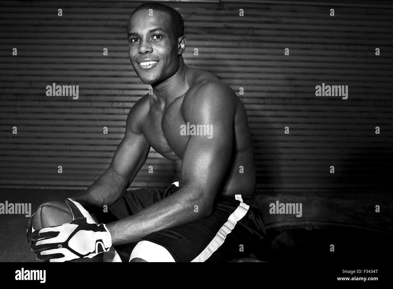 A football player poses for a portrait in his training space Stock ...