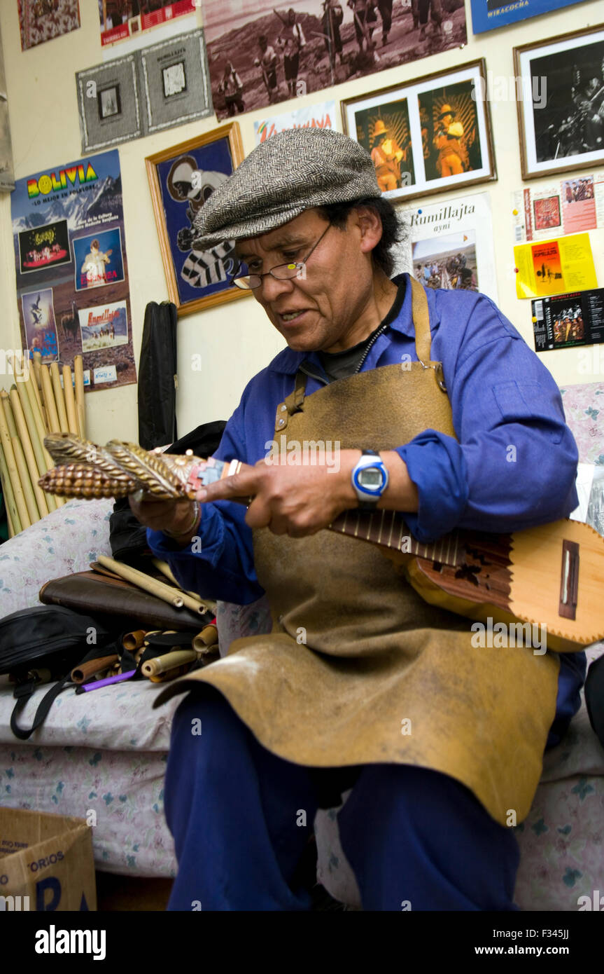Artisan Adrian Villanueva Quisbert making a charango, a traditional ...