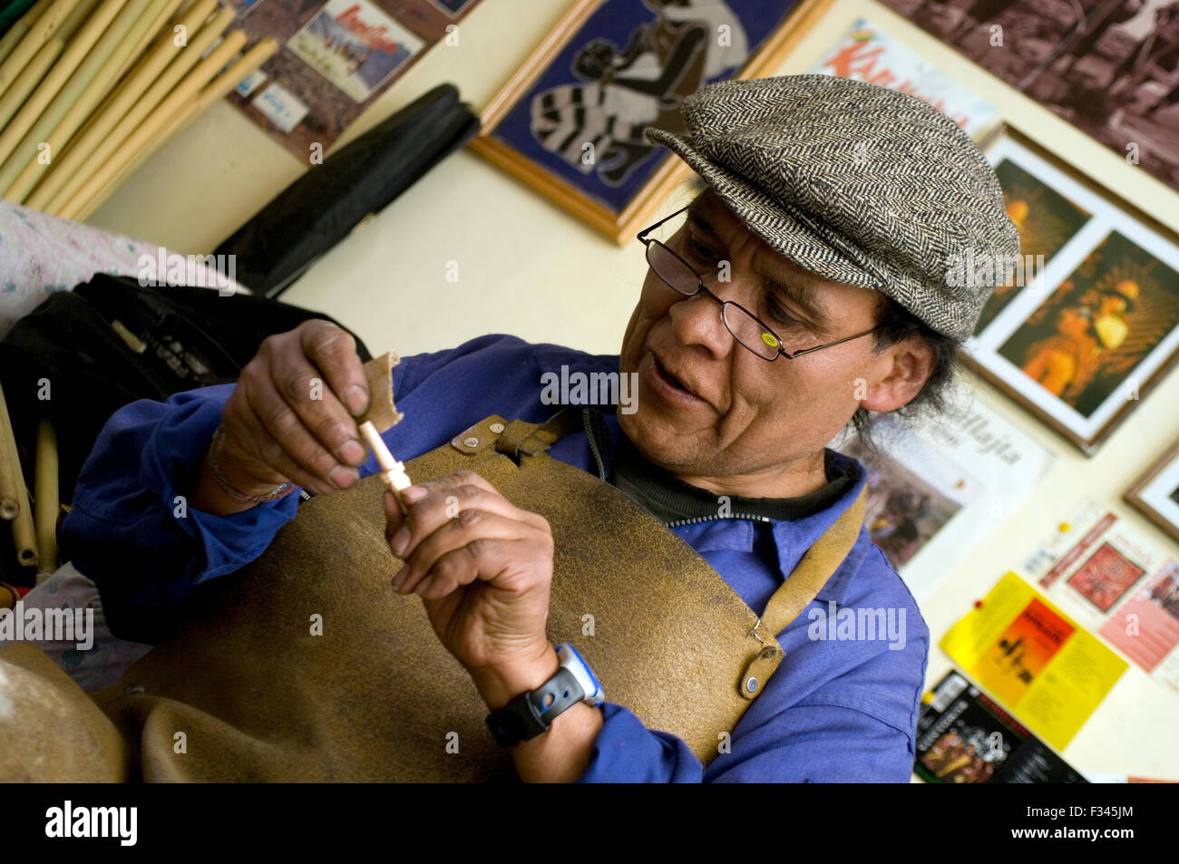 Artisan Adrian Villanueva Quisbert making a charango, a traditional ...