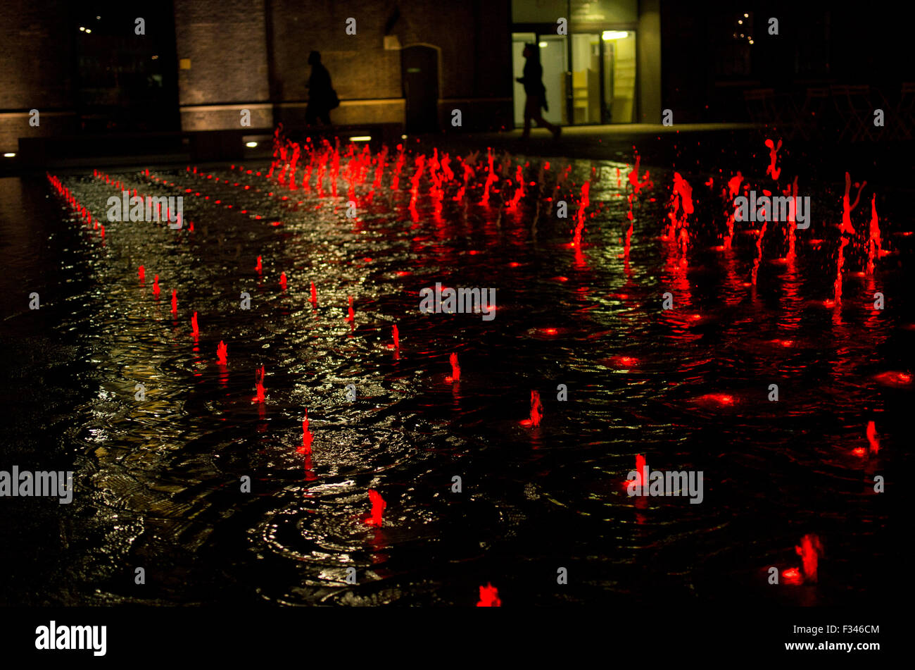 Colourful fountains behind Kings Cross station on Granary Sqare Stock ...