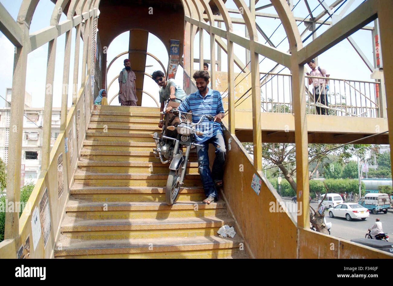 Motorist passes through on pedestrian bridge that creating problems for ...