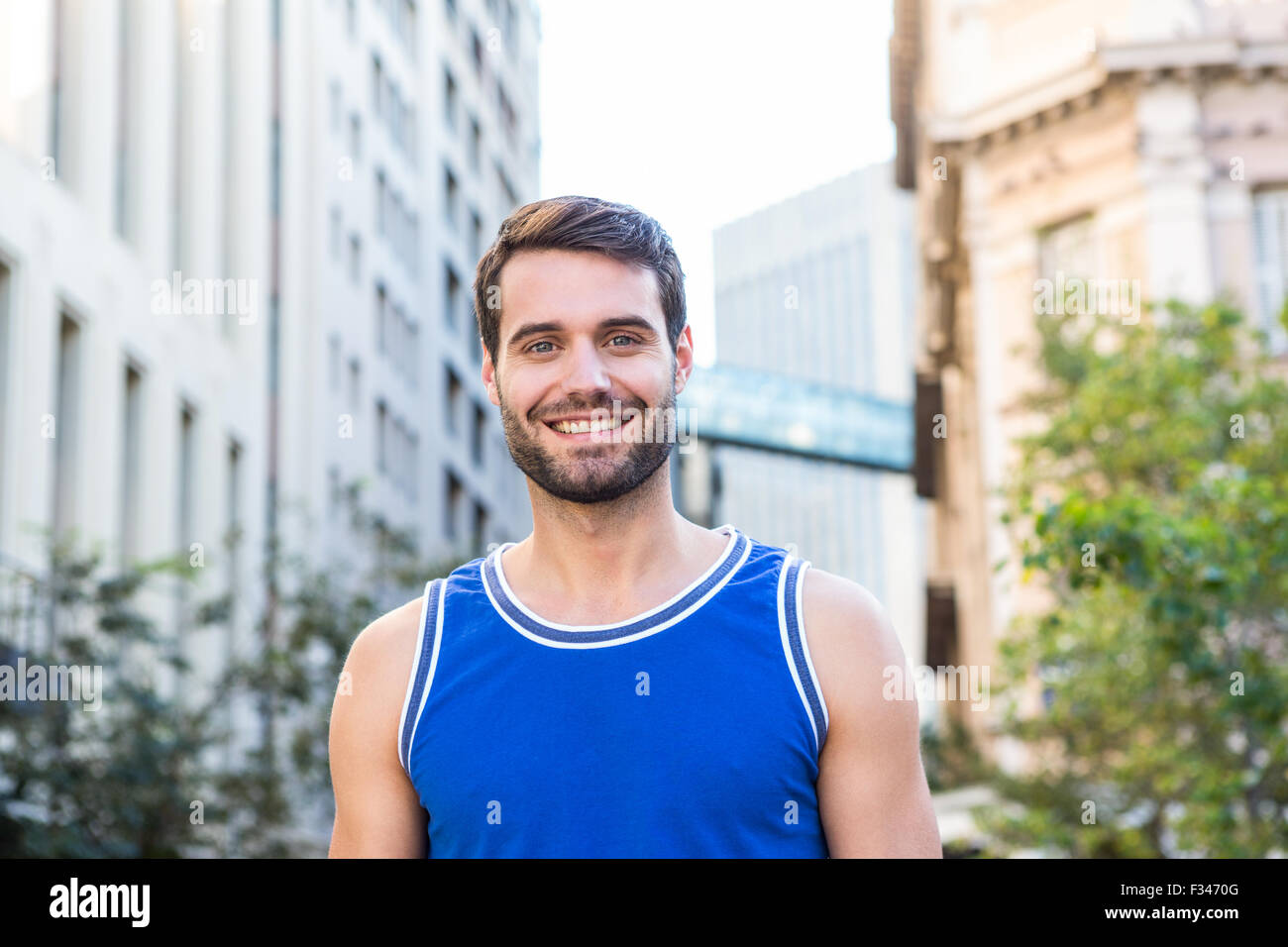 Handsome athlete smiling Stock Photo - Alamy