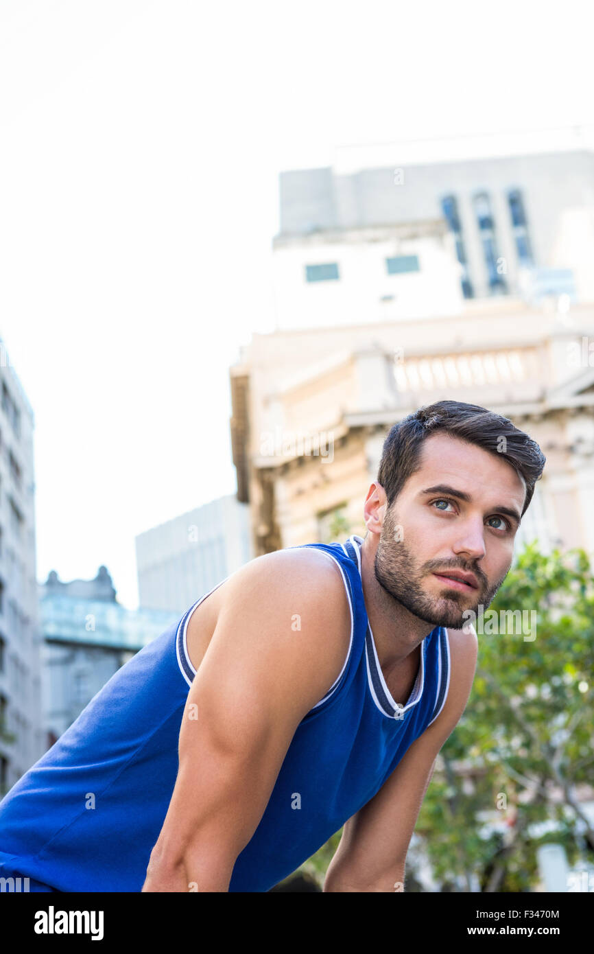 Determined handsome athlete looking away Stock Photo - Alamy