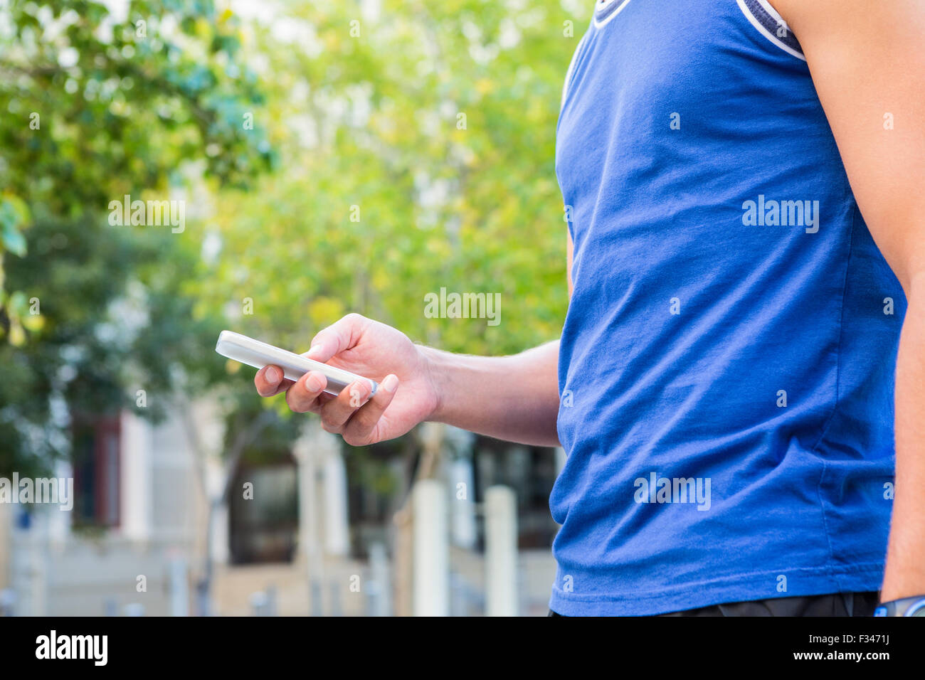 Athlete man using mobile hi-res stock photography and images - Alamy