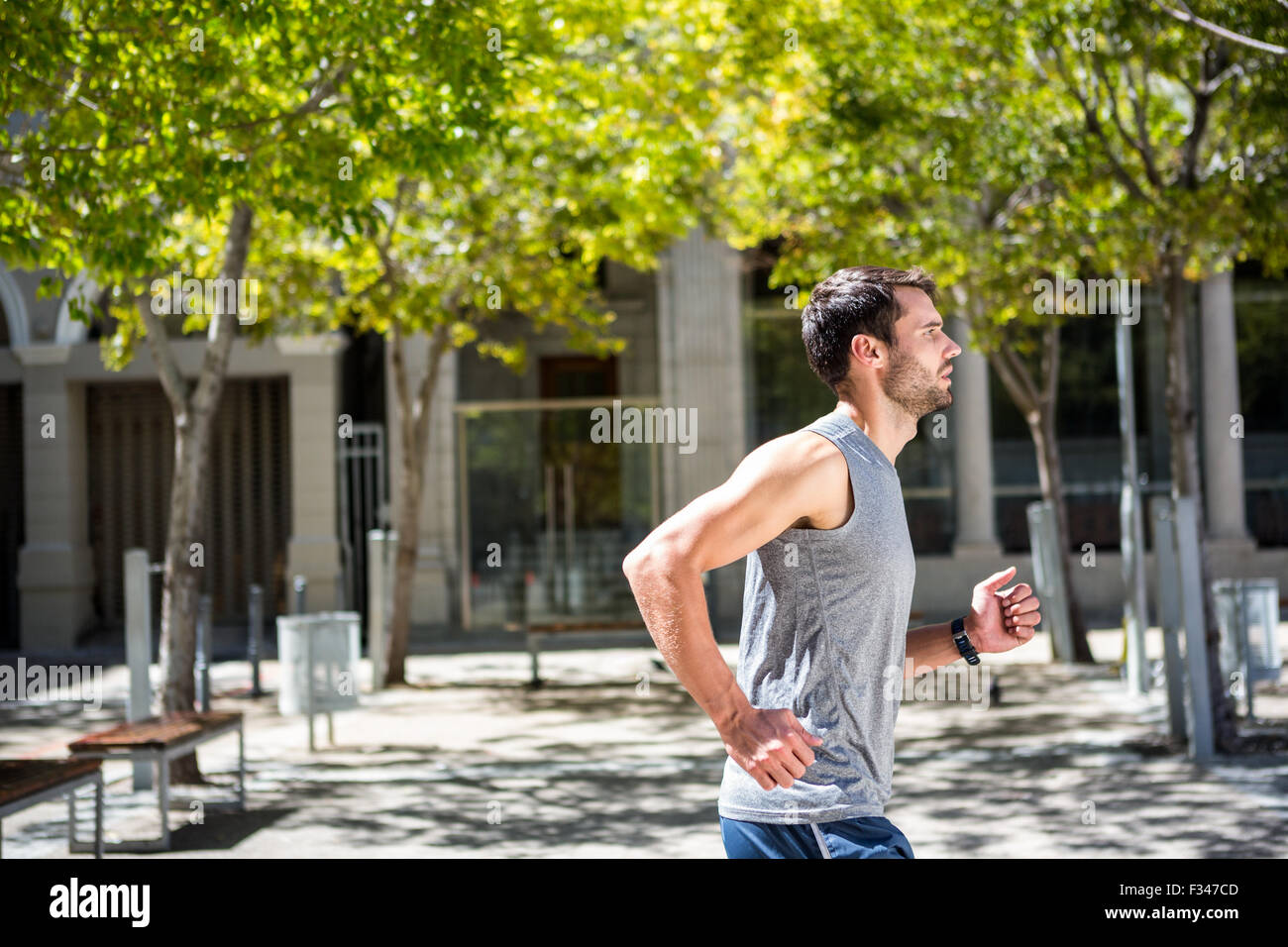 Handsome athlete running in the street Stock Photo - Alamy