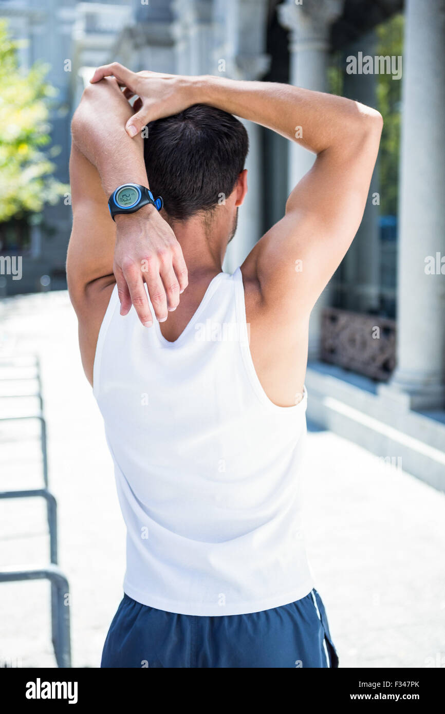 Rear view of athlete stretching his arm Stock Photo - Alamy