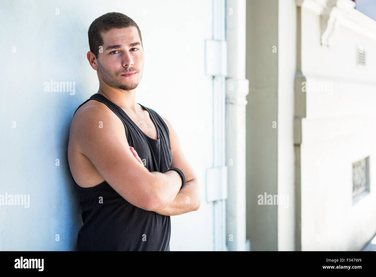 A handsome athlete arm crossed Stock Photo - Alamy