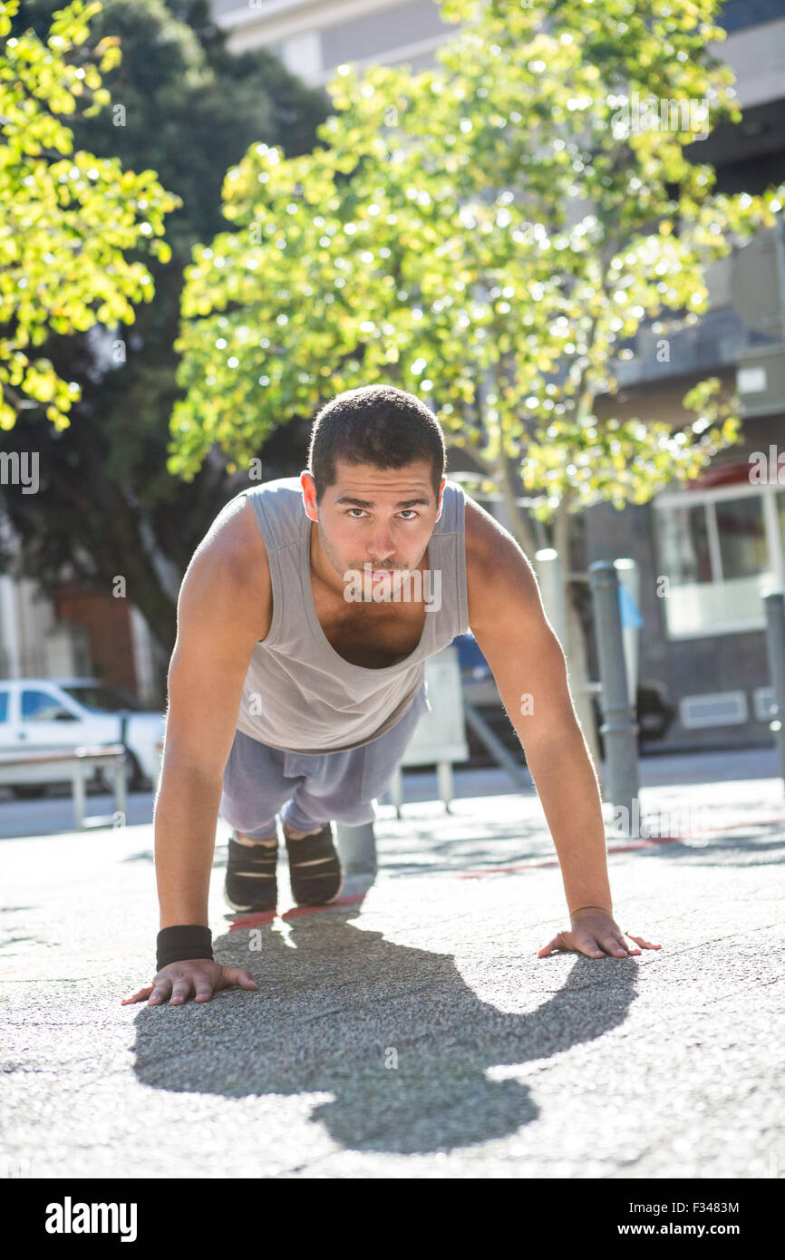 A muscular man on plank position Stock Photo - Alamy