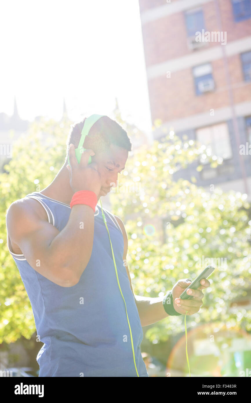 A handsome athlete using his phone Stock Photo - Alamy
