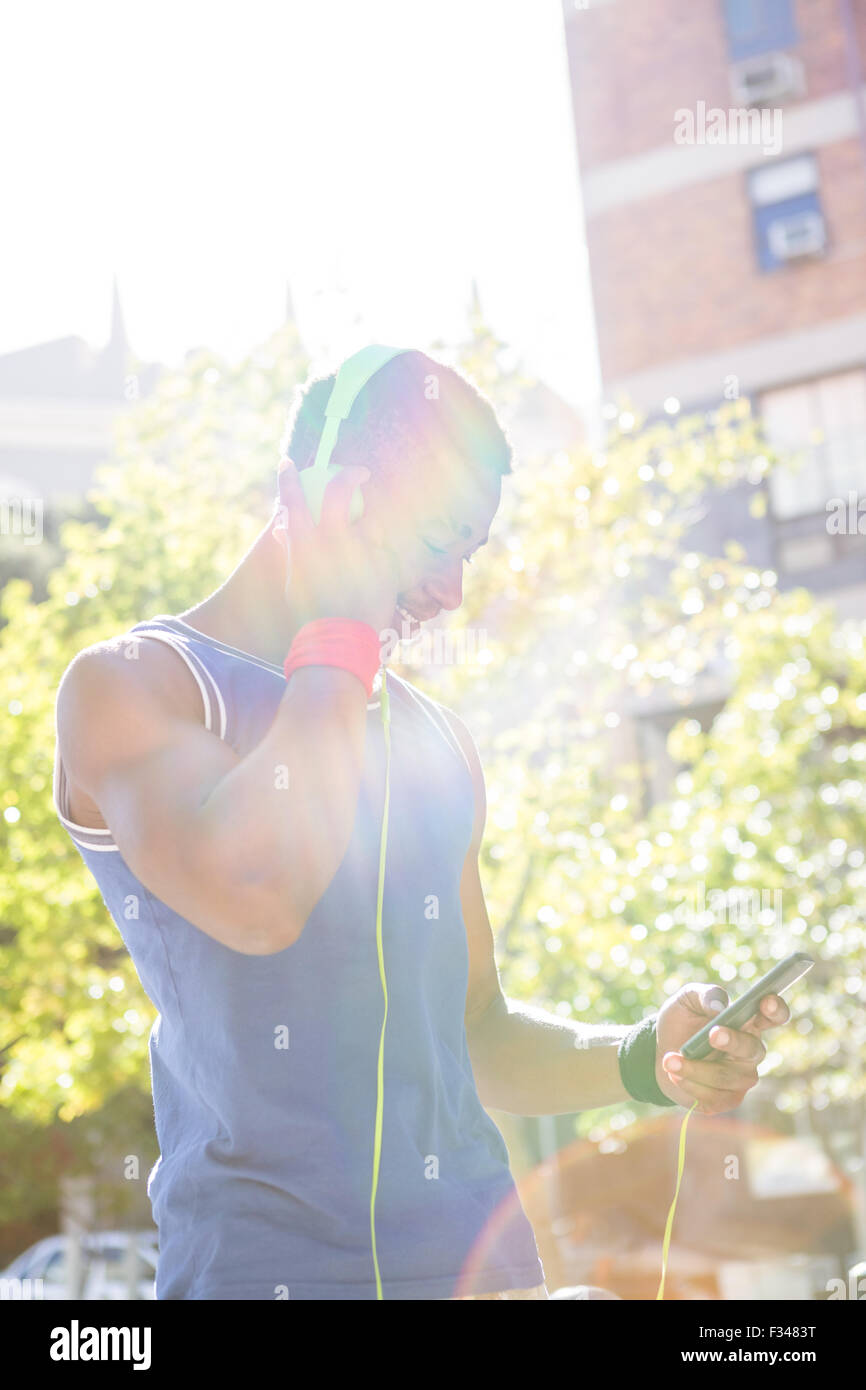 A handsome athlete using his phone Stock Photo - Alamy