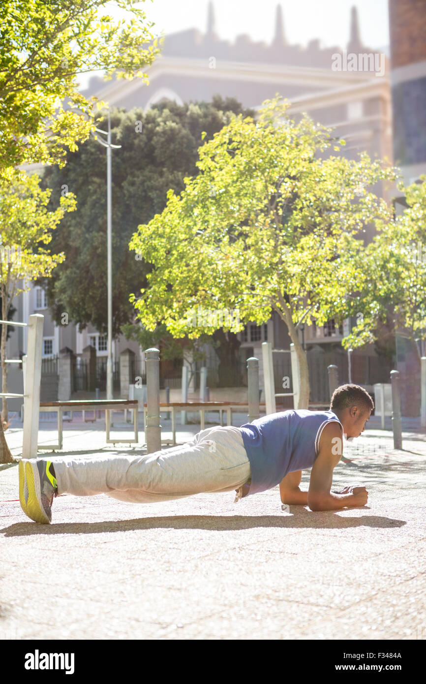 A muscular man on plank position Stock Photo - Alamy