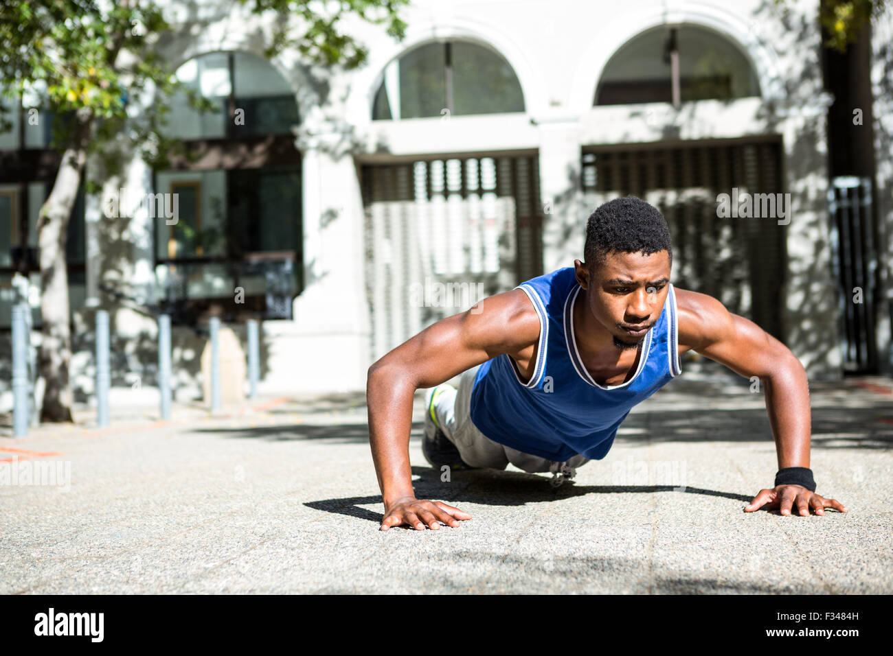 Happy athlete doing push-ups Stock Photo - Alamy