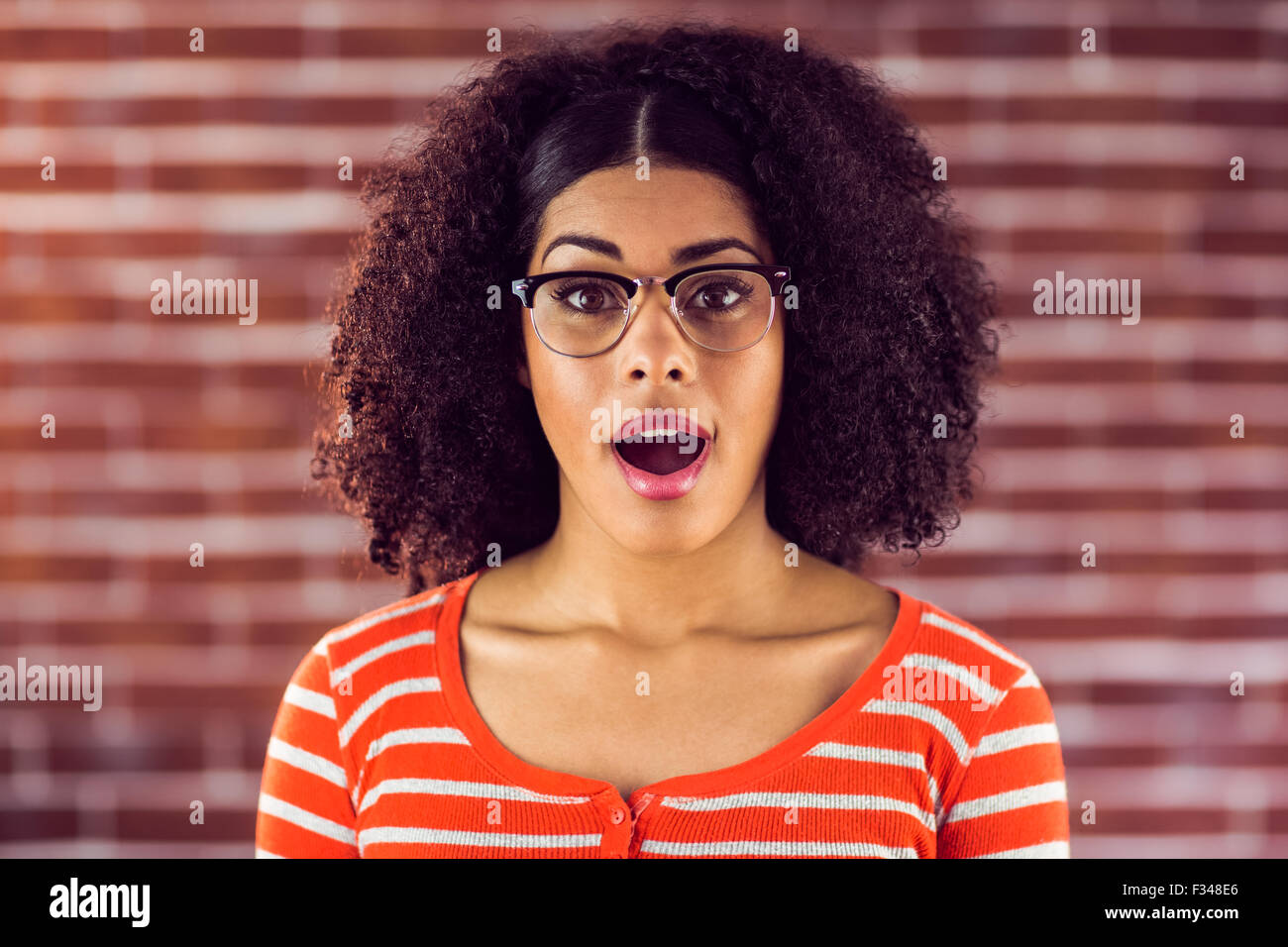 Surprised attractive young woman Stock Photo - Alamy