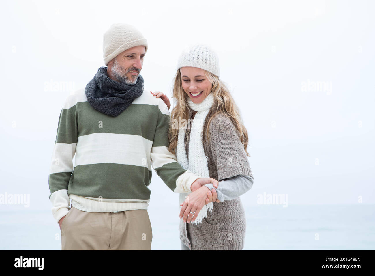 Cute couple standing together Stock Photo - Alamy
