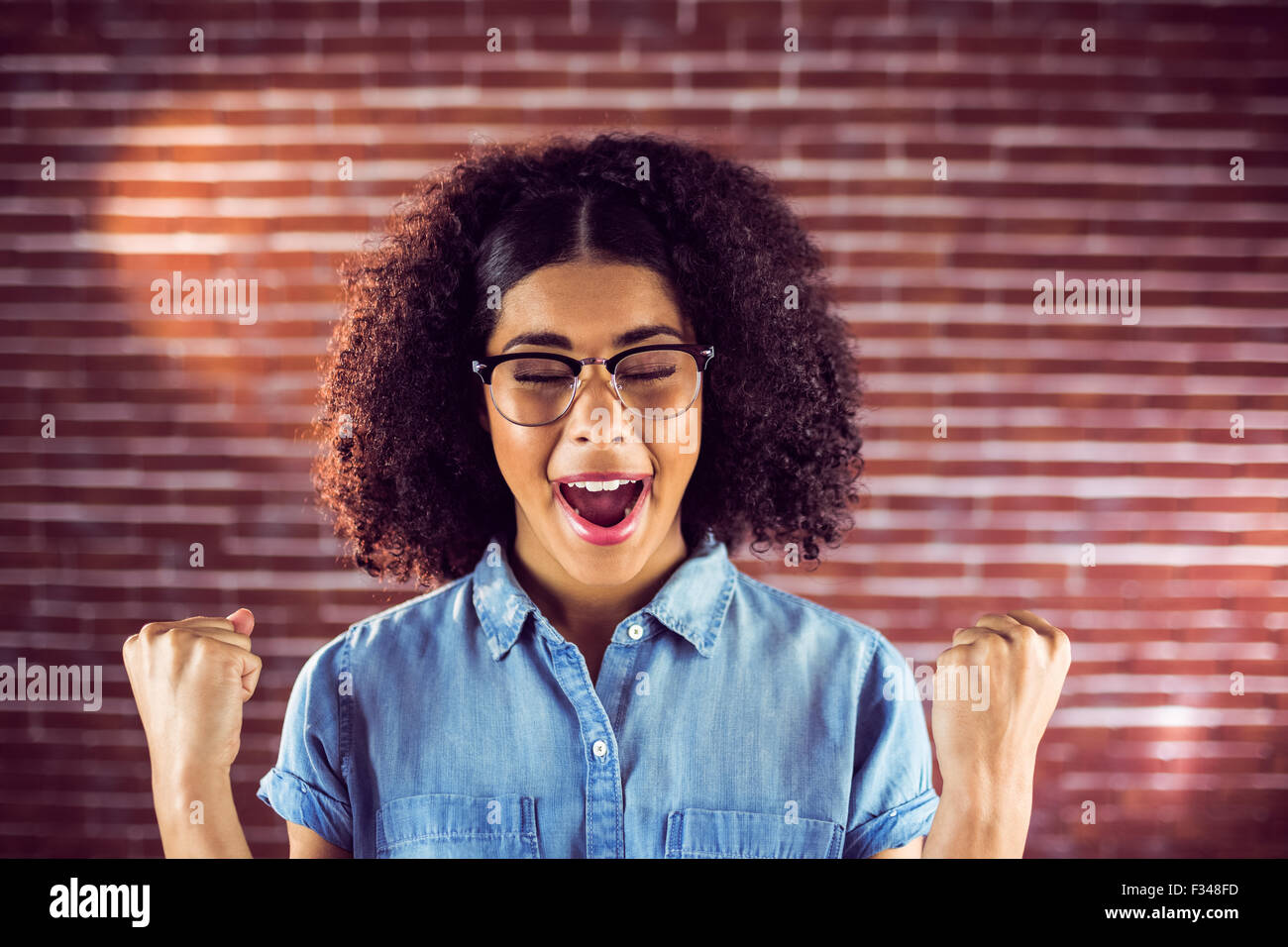 Excited black woman celebrating success hi-res stock photography and images - Alamy